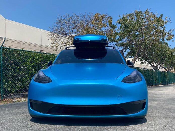 This custom wrapped Tesla Model Y with the roof racks and matching ...