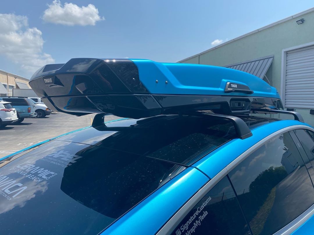 This custom wrapped Tesla Model Y with the roof racks and matching ...