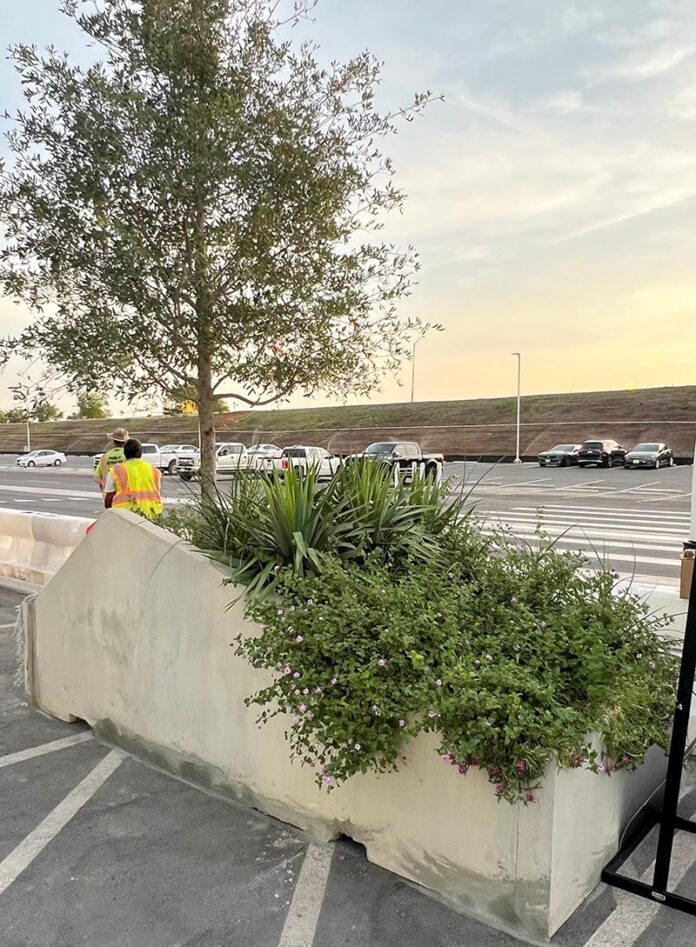 Tesla decorates Giga Texas with Cybertruck-shaped planters aka Cyber ...